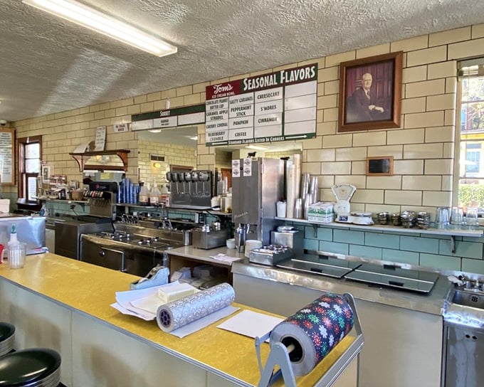 Behind this unassuming counter, ice cream alchemy happens daily—where seasonal flavors line up like sweet soldiers ready for duty.