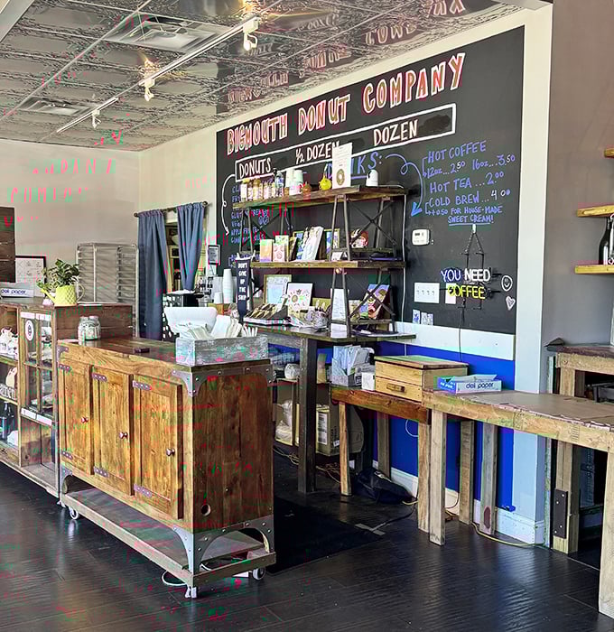 Rustic wooden counters and industrial shelving create a space that feels both modern and timeless—like donuts themselves.