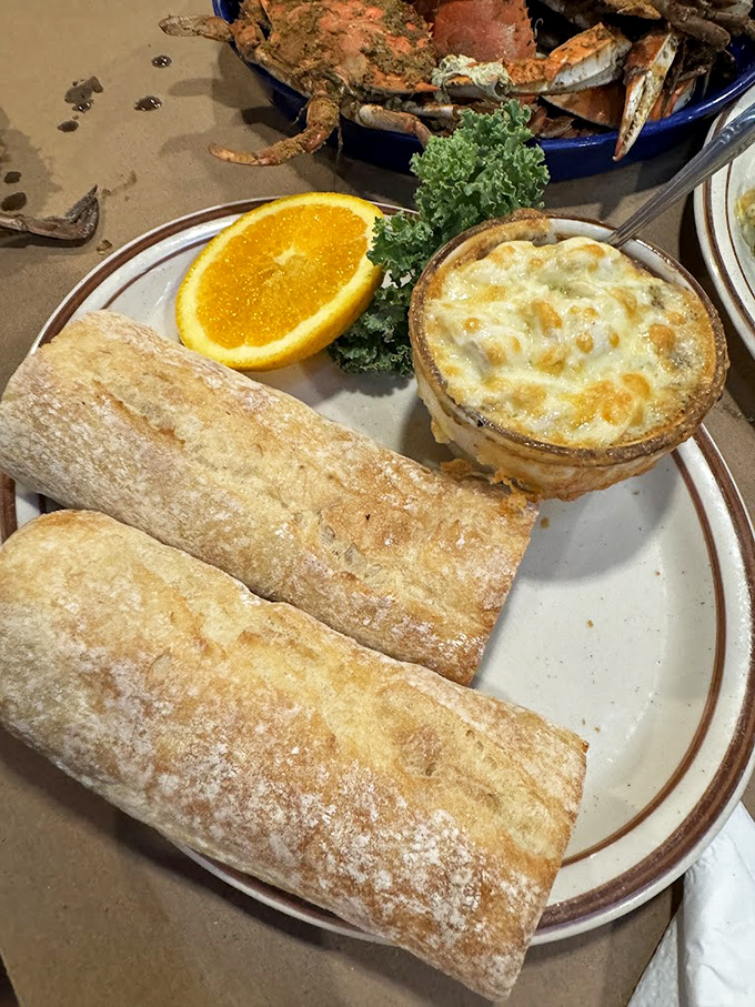 Bubbling crab dip and crusty bread—the kind of appetizer that makes you consider canceling your entrée and ordering three more of these instead.