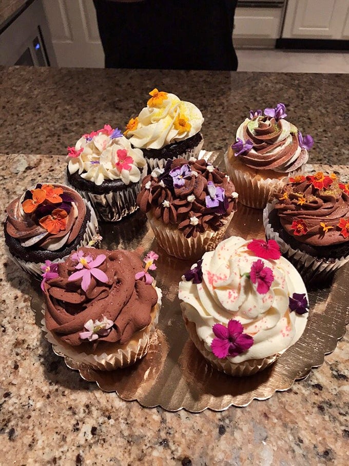 These cupcakes wear edible flowers like tiny hats at the Kentucky Derby—both festive and utterly irresistible.