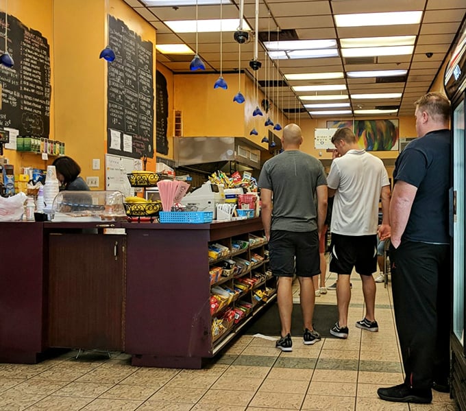 The line forms quickly but moves steadily—a choreographed dance of hunger, anticipation, and the promise of satisfaction.