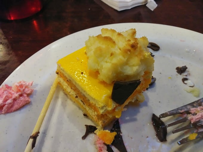 A slice of sunshine-yellow cake that whispers, "There's always room for dessert," and somehow, miraculously, there always is.