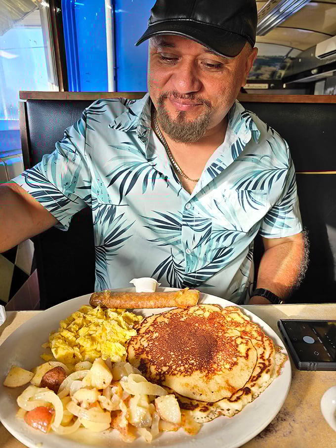 A breakfast spread that makes morning people out of night owls—golden pancakes, scrambled eggs, and potatoes that justify early rising.