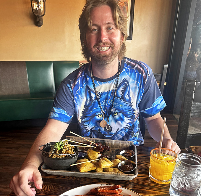 Pure joy captured in a wolf shirt – the universal expression of someone who just discovered exotic meats.