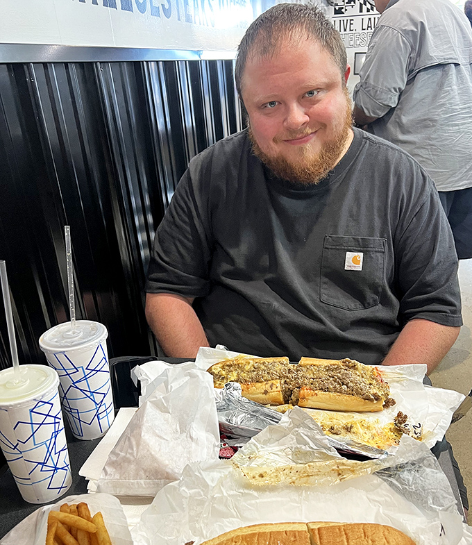 The look of pure satisfaction. That's not just a smile—that's the universal expression of "I've found my new favorite sandwich spot."