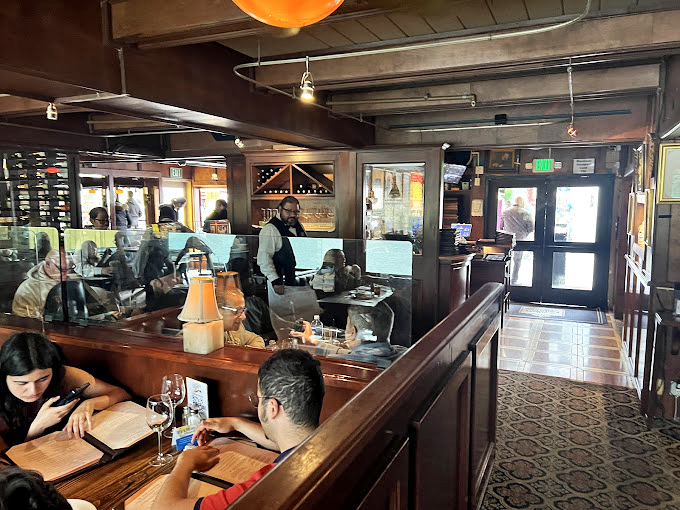 The dining room hums with contentment – that universal sound of people discovering something truly special.