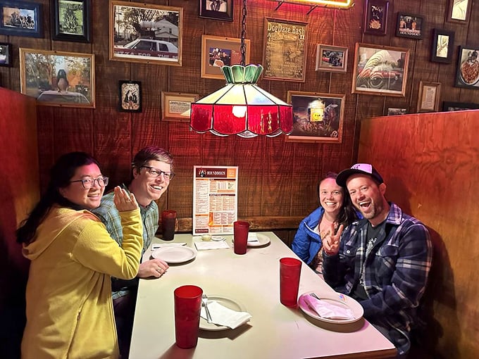 Happy diners sharing pizza moments that'll become tomorrow's favorite food memories and stories.