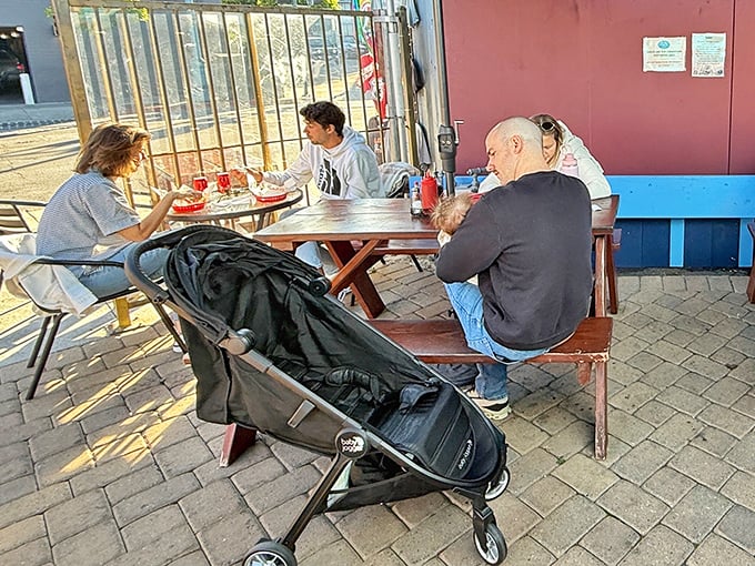 Families gathering over baskets of goodness – this is what community dining looks like in the real world.