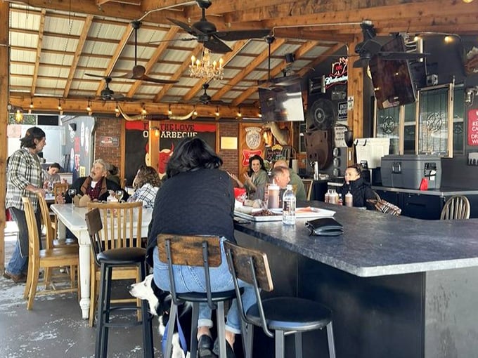 The communal tables aren't just for eating – they're where BBQ philosophies are debated and Tampa friendships are forged.