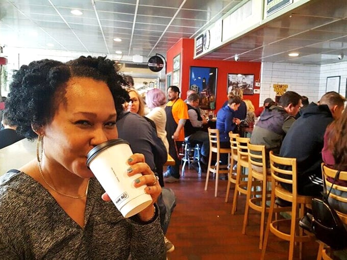 The café's bustling interior where coffee fuels conversation and strangers become temporary neighbors in this Cleveland culinary community.