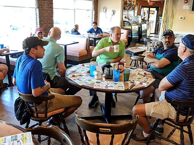 The round table regulars solve world problems over bottomless coffee cups, a morning ritual as American as the diner itself.