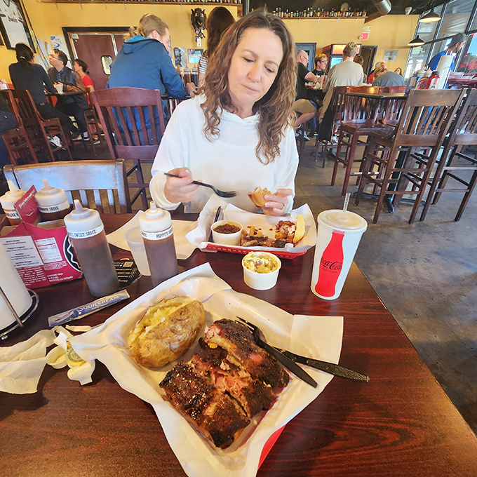 The look of someone experiencing Pappy's for the first time—equal parts concentration and bliss. This isn't eating; it's communion.