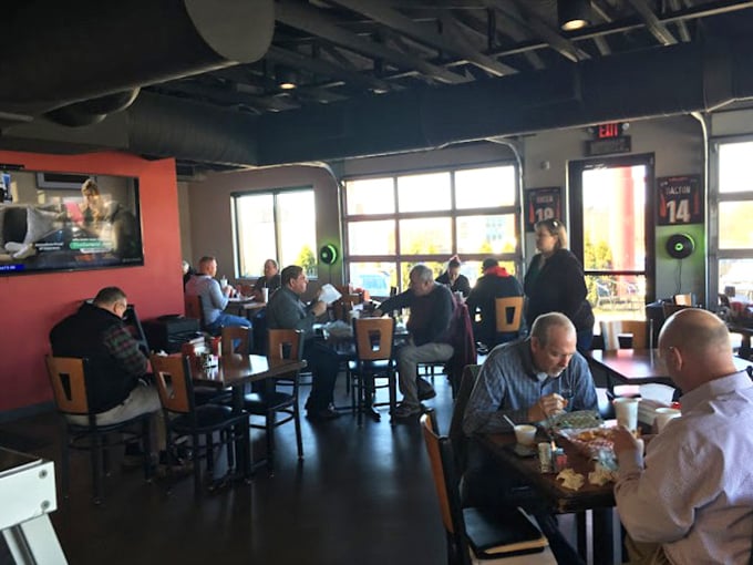 The universal language of BBQ brings together a diverse crowd. Notice the absence of conversation—everyone's too busy experiencing meat nirvana.