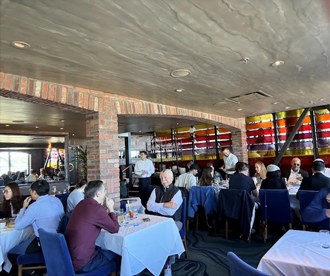 The dining room buzzes with the symphony of satisfaction—clinks of glasses, murmurs of approval, and the occasional gasp at first bites.