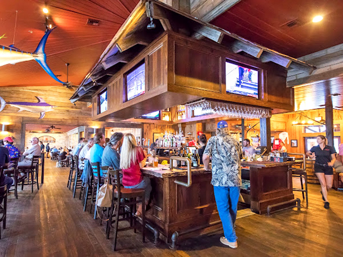 The bar at Boshamps—where strangers become friends and vacation stories are swapped over cold drinks and warm laughter.