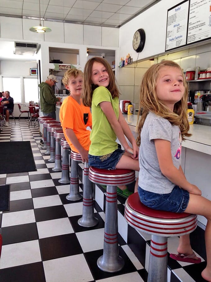 The counter stools aren't just seats—they're front-row tickets to the greatest show in town, where kids discover the magic of diner culture one spin at a time.
