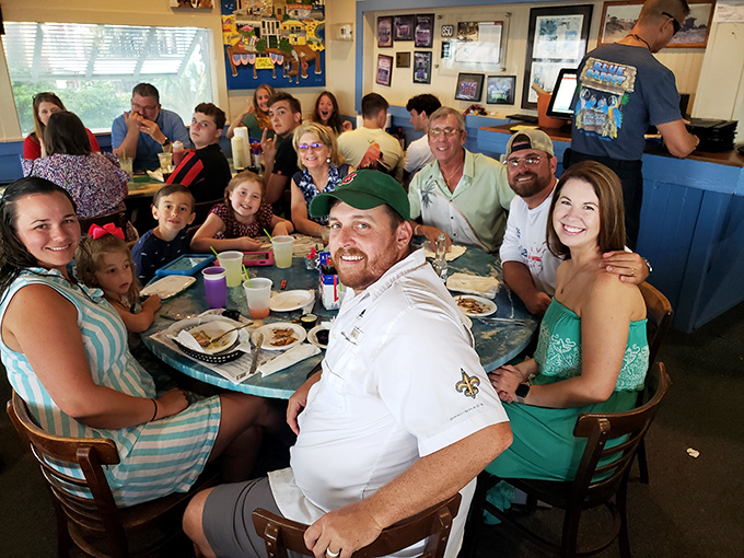 Family memories being made between bites. These folks didn't just find a meal—they found the chapter highlight of their vacation story.