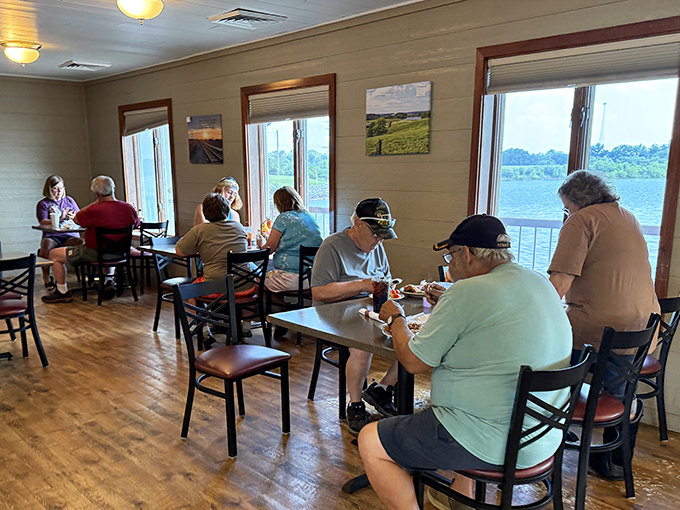 Where locals gather to enjoy lake views and hearty meals. Notice how nobody's looking at their phones—the food commands full attention.