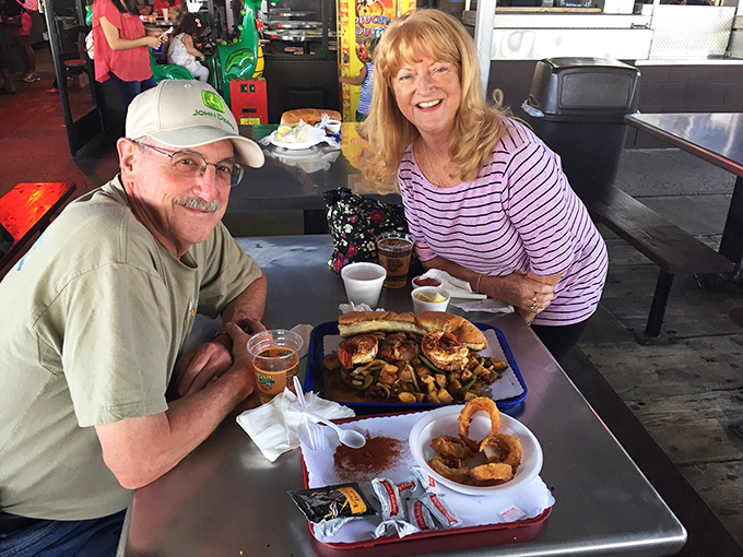 The universal language of seafood satisfaction – these diners have found their happy place among the shrimp and sunshine.