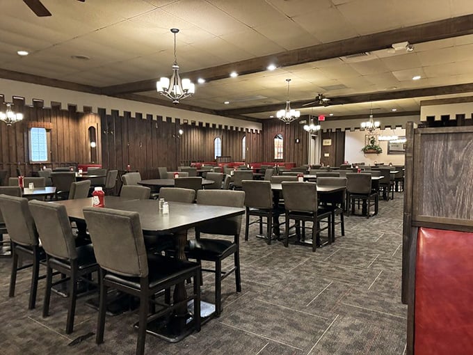 The dining room stands ready for its daily performance, with tables arranged like an orchestra waiting for its conductor—you and your appetite.