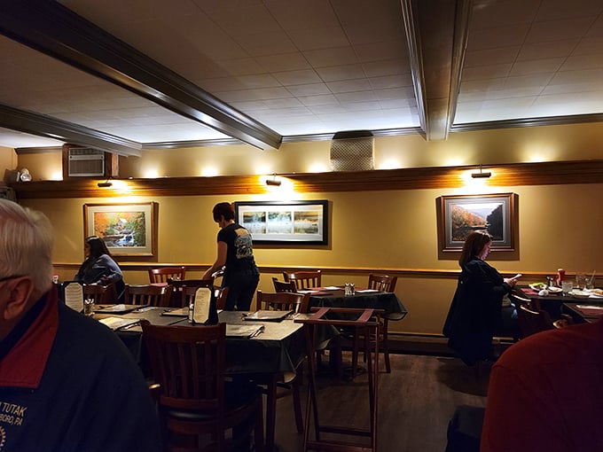 Warm lighting, landscape paintings, and wooden chairs that have supported generations of happy diners. The kind of room that feels like Sunday dinner at a wealthy relative's home.