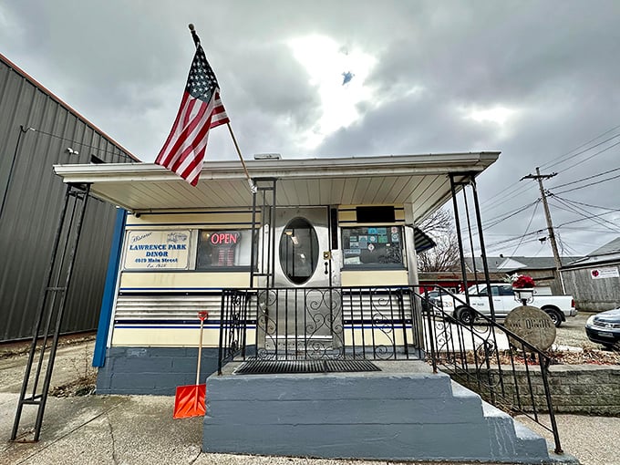 The American flag stands guard over this temple of comfort food. Even on cloudy days, the "OPEN" sign shines like a beacon of hope.