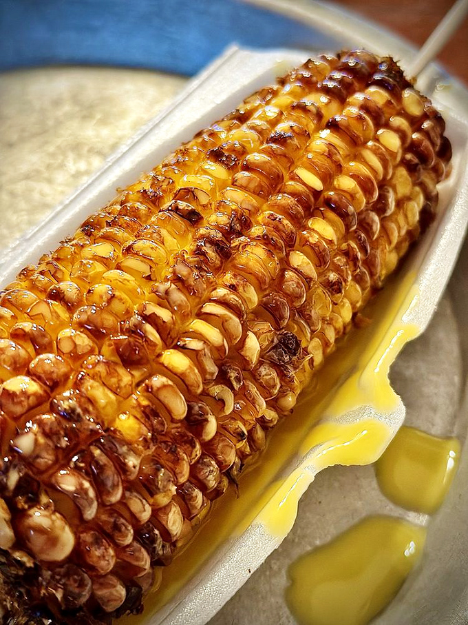 Butter cascading down fire-kissed corn like a delicious yellow waterfall. This isn't just a side dish—it's summer captured on a plate.