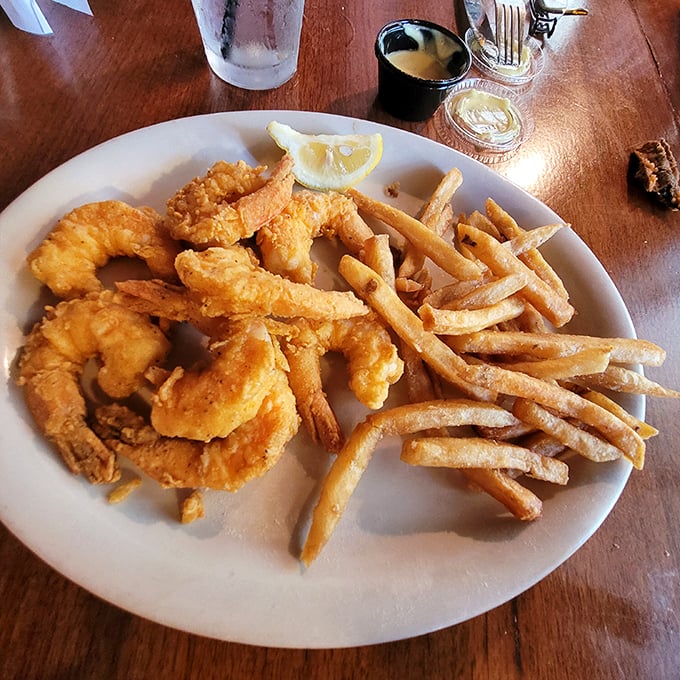 These golden-battered shrimp and hand-cut fries aren't just seafood – they're edible sunshine that captures the essence of coastal Florida on a plate.