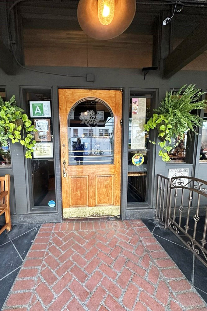 The wooden door with its etched glass kettle logo isn't just an entrance—it's a portal to comfort food nirvana that's welcomed generations.