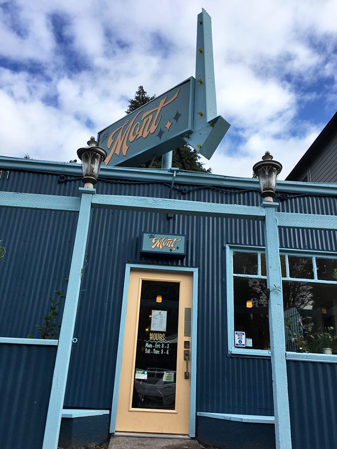 That retro-modern sign jutting skyward says, "Yes, we're serious about breakfast" in the international language of neon and nostalgia.