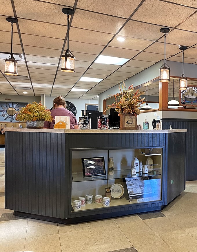 The hostess stand—first checkpoint on your journey to comfort food nirvana. Those pendant lights cast the perfect glow for important pie-selection decisions.