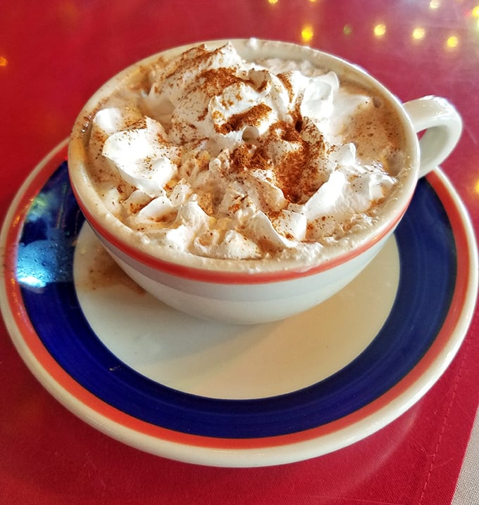 Mexican hot chocolate topped with whipped cream—like a warm hug in a mug, with cinnamon playing the role of best supporting spice.