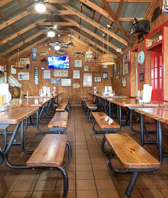 Church of BBQ: wooden pews, vaulted ceilings, and walls adorned with the sacred texts of smoked meat culture. Salvation comes with extra napkins.