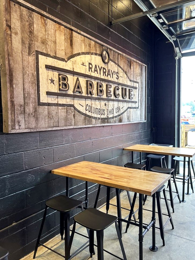 Industrial-chic meets smoke-house practicality. Those wooden tables aren't just furniture—they're front-row seats to the best show in Columbus.