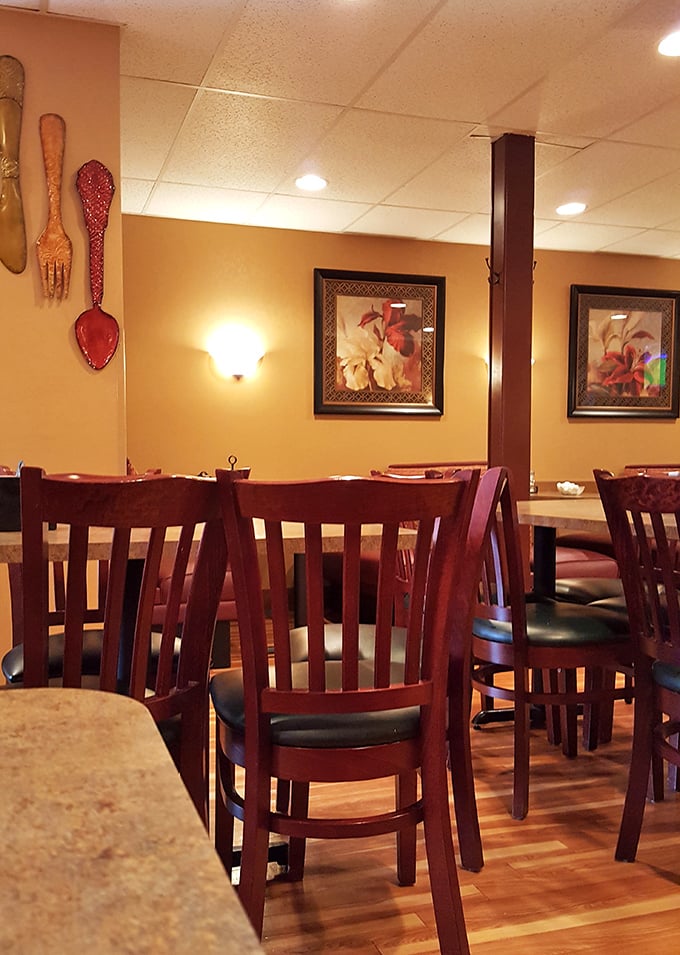 Those oversized wooden forks and spoons on the wall aren't just decoration—they're a warning about the portion sizes you're about to encounter.