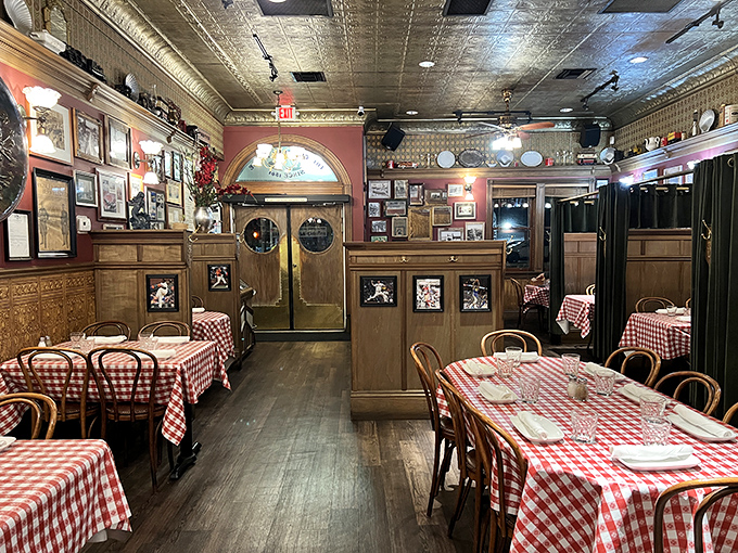 Red walls adorned with history, wooden booths polished by generations of elbows. This dining room feels more like a maritime museum where you can eat the exhibits.