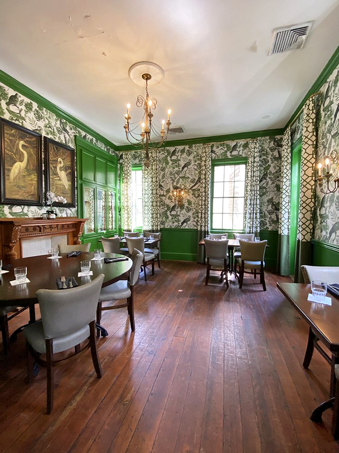 Another angle of the Green Room reveals why it's impossible to get a reservation—it's basically Southern hospitality wrapped in designer wallpaper.
