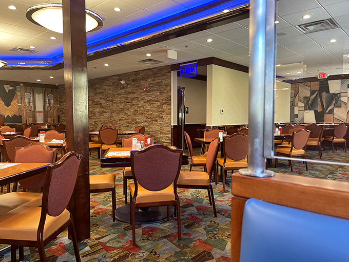 The dining room's warm wood tones and colorful carpet create the perfect backdrop for life's important conversations—and impulsive dessert decisions. 