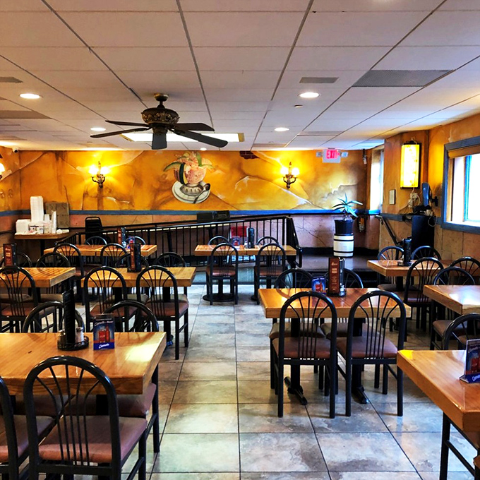 The dining room whispers promises of memorable meals with its warm lighting and colorful murals. Even empty, it's full of possibilities. 