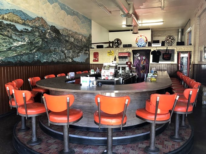 The curved counter isn't retro by design—it's retro by survival, with a stunning mountain mural that's witnessed decades of satisfied customers.