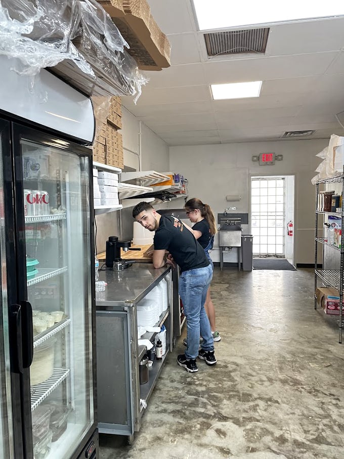 Behind the scenes, the prep area might not be glamorous, but it's where the magic begins before those pies hit the oven. 