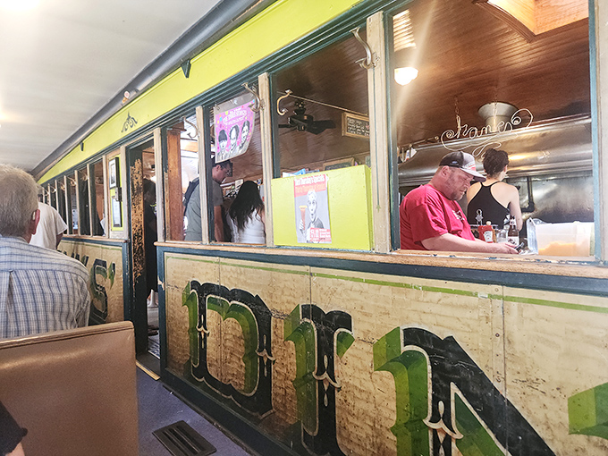 The narrow dining car layout isn't cramped—it's cozy, like dining in a piece of American history where every seat feels like the best one.