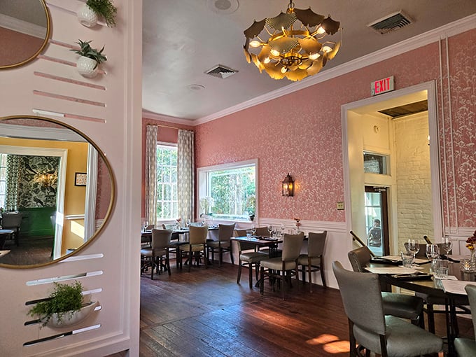 The pink dining room offers a different mood entirely—soft, elegant, and bathed in natural light that makes every dish look even more Instagram-worthy.