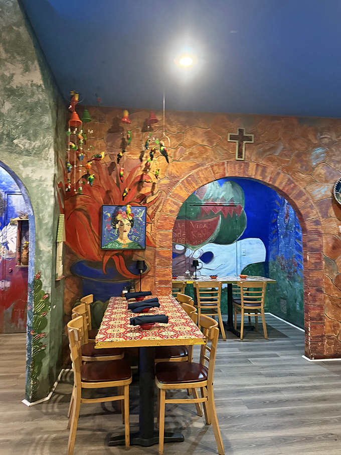 Dining under brick archways and colorful murals isn't just eating—it's time travel. That Frida portrait watches approvingly as you contemplate a second margarita.