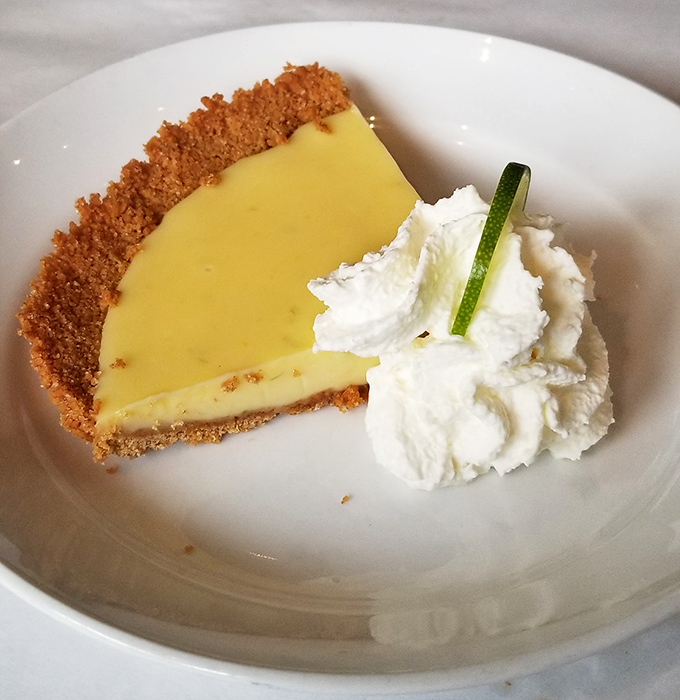Key lime pie that strikes the perfect balance between sweet and tart—like finding the ideal comeback only seconds after the conversation ended.