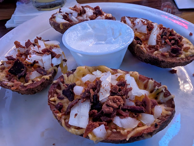 Loaded potato skins that remind you why some bar food classics never go out of style—a perfect harmony of crispy, gooey, and savory.