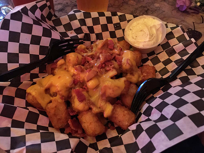 Loaded tots—where potatoes go to fulfill their cheesy, bacon-topped destiny. A fork is merely a suggestion here.