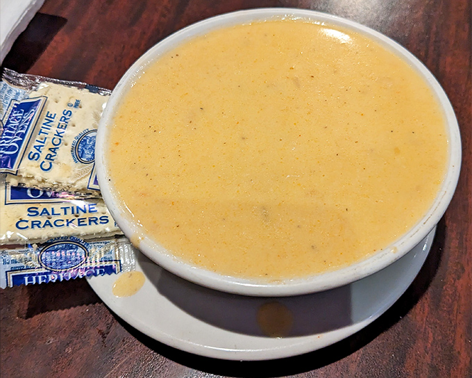 This soup isn't just bisque—it's a warm hug in a bowl, complete with saltines standing by for the perfect dipping companion.