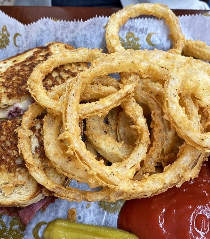 Crispy, golden onion rings that shatter with each bite, paired with a sandwich that means business. This isn't fast food—it's good food, served fast.