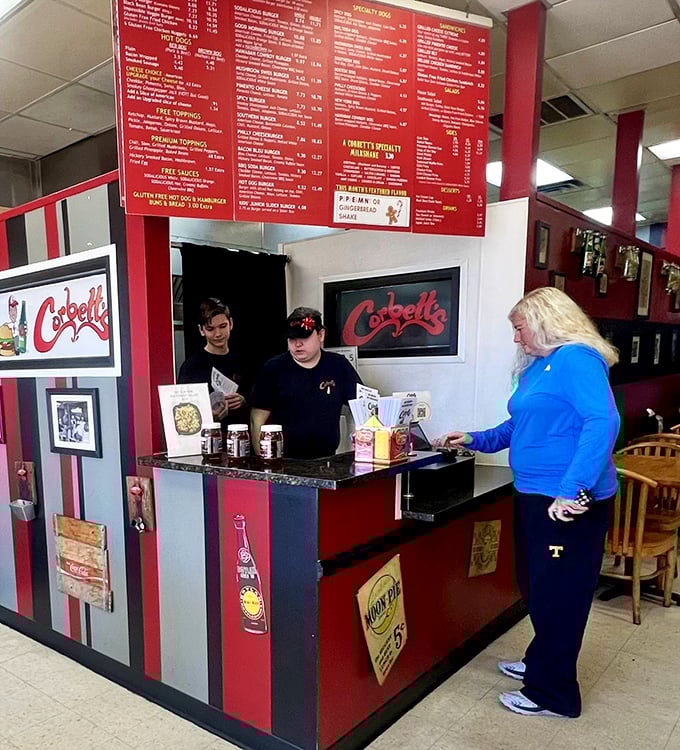 Where the magic happens—red and black striped counter where friendly faces turn orders into edible happiness.